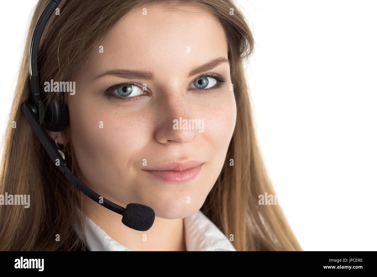 Portrait of young beautiful smiling call center worker talking to ...