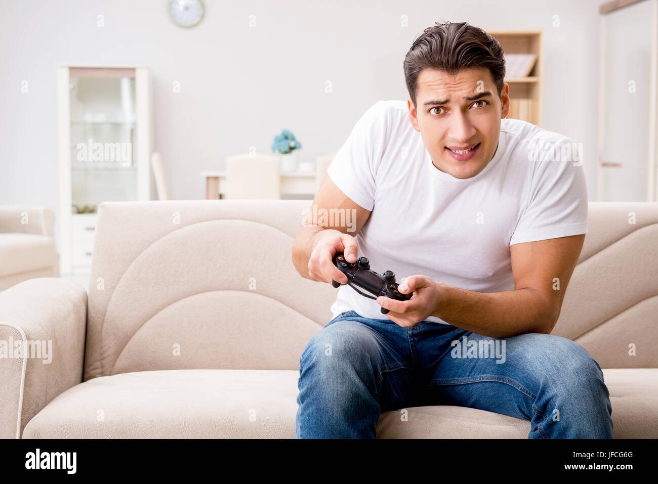 Man addicted to computer games Stock Photo - Alamy
