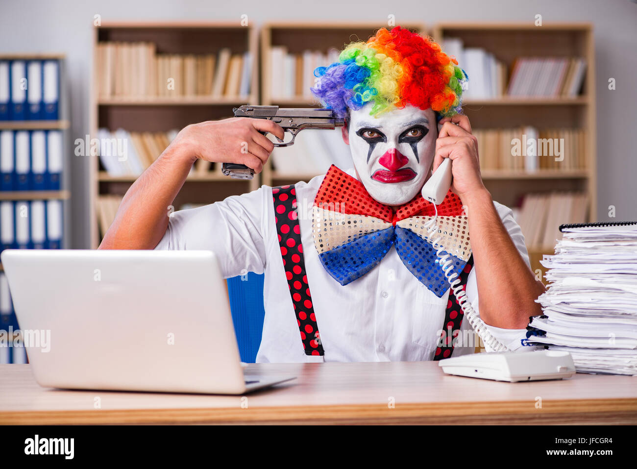 Clown businessman working in the office Stock Photo - Alamy