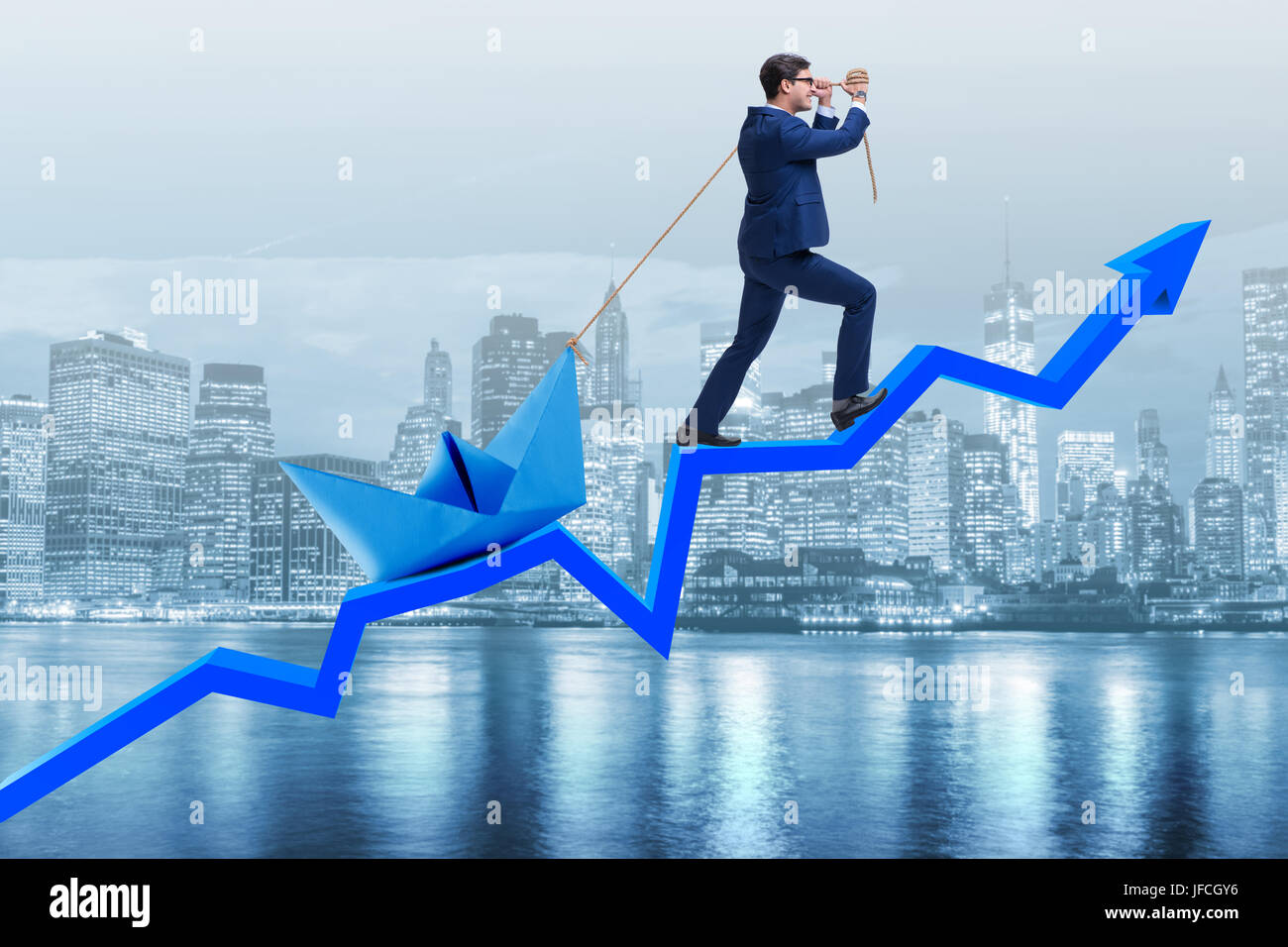 Businessman pulling boat over line chart Stock Photo - Alamy