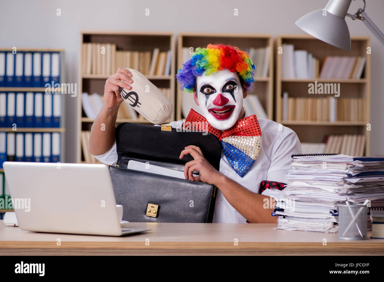 Clown businessman working in the office Stock Photo - Alamy