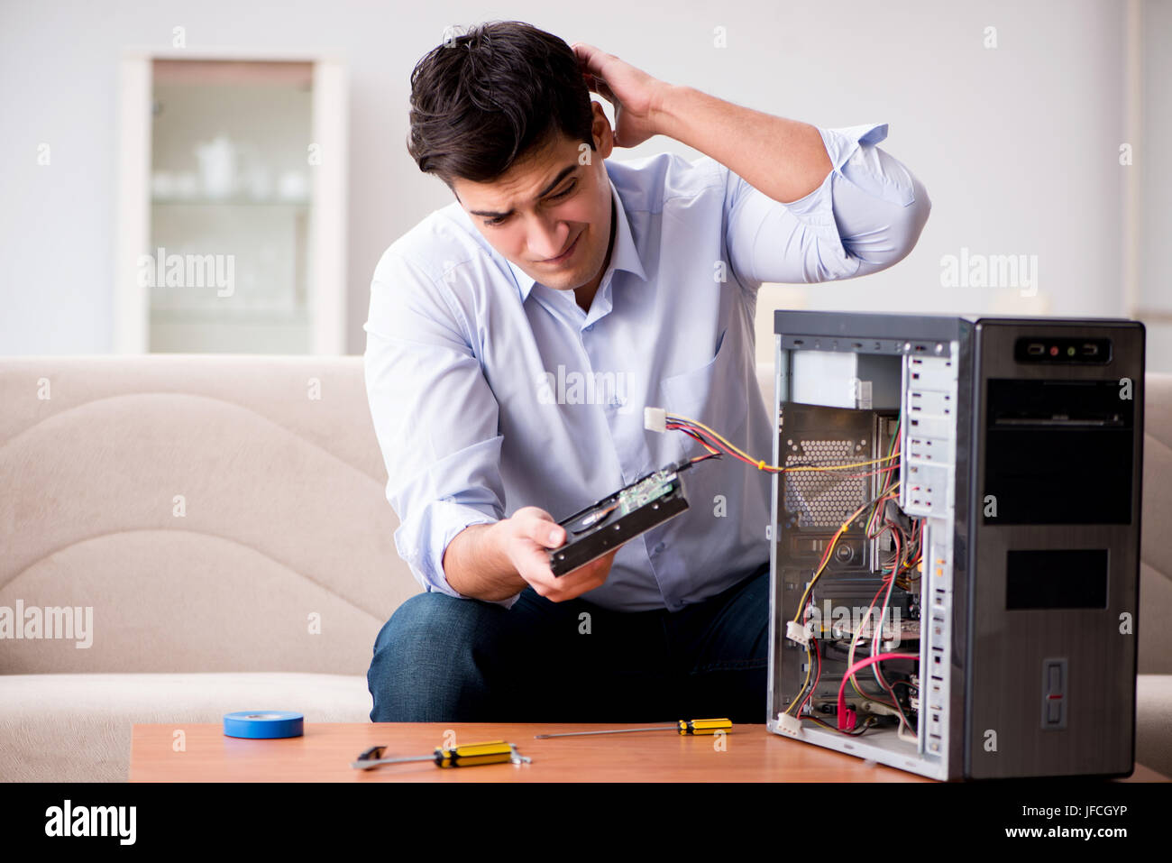 Frustrated man with broken pc computer Stock Photo - Alamy