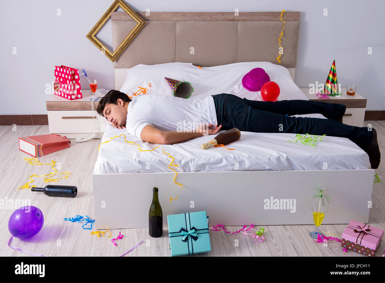 Man at home after heavy partying Stock Photo - Alamy