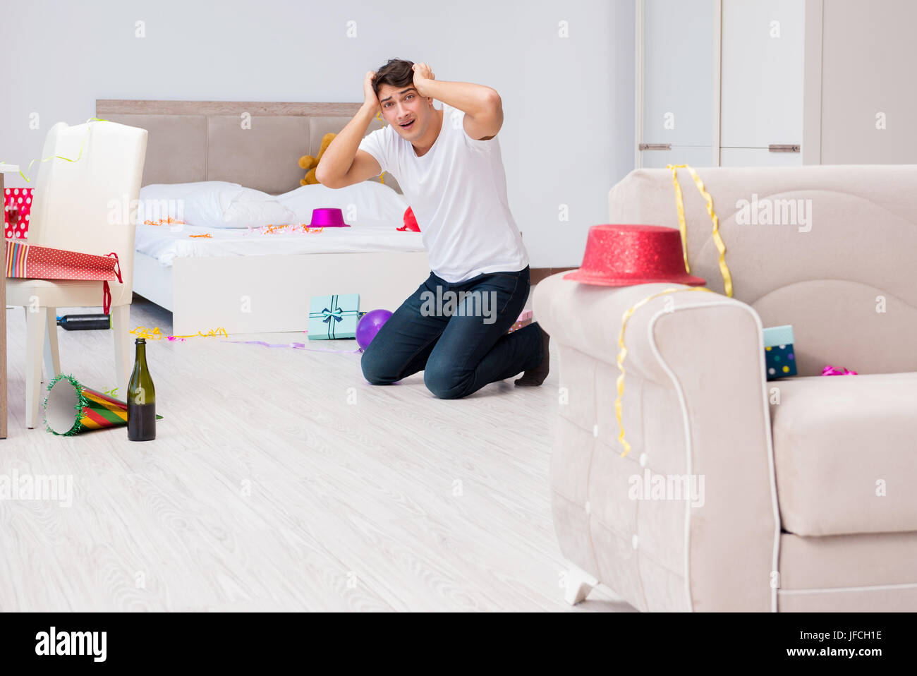 Man at home after heavy partying Stock Photo - Alamy