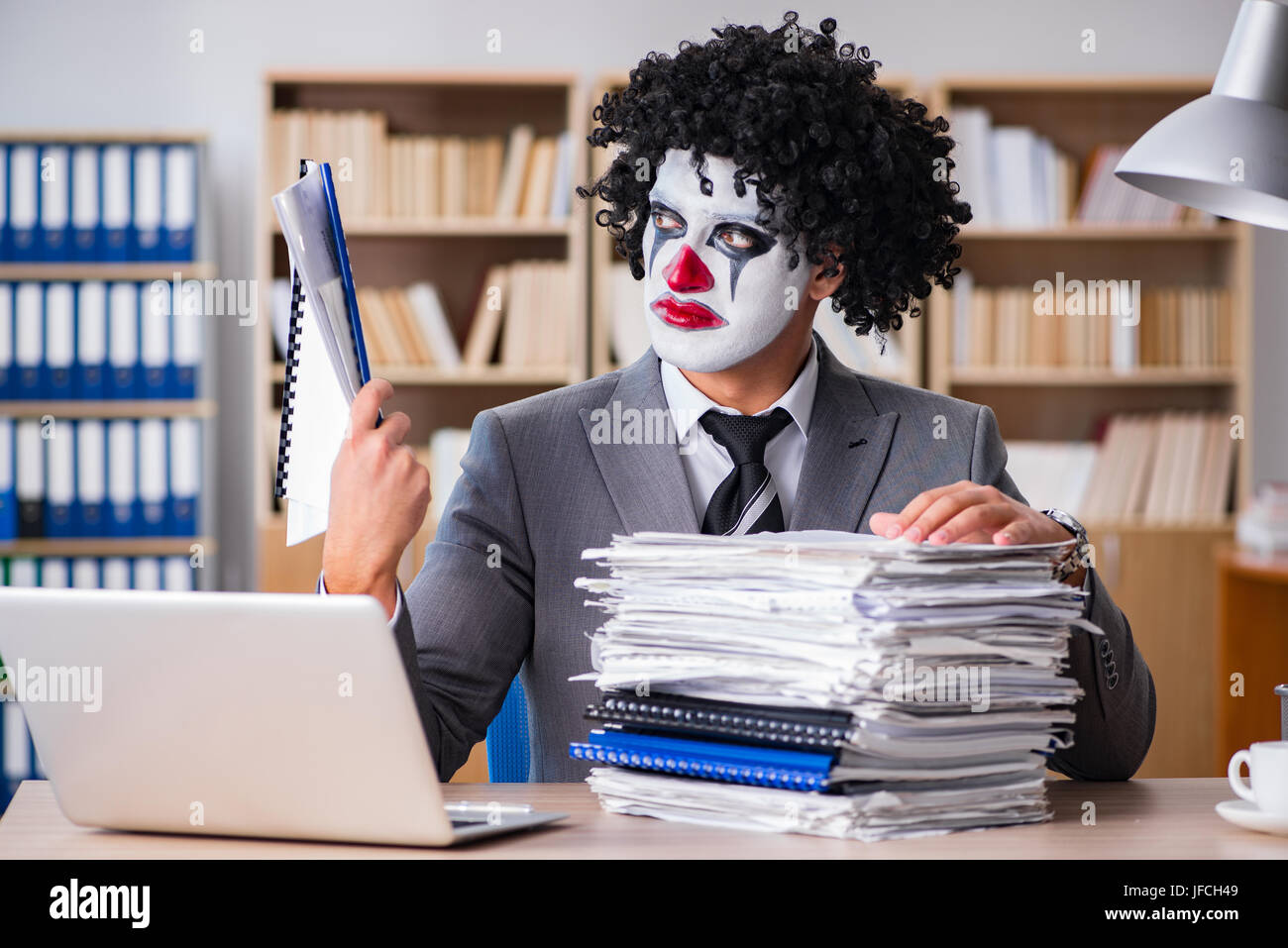 Clown businessman working in the office Stock Photo - Alamy
