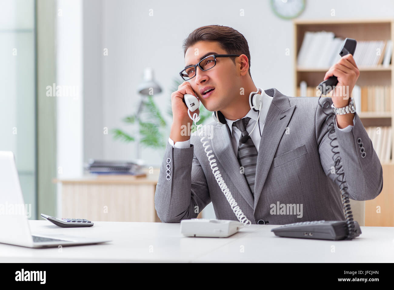 Angry helpdesk operator in the office Stock Photo - Alamy