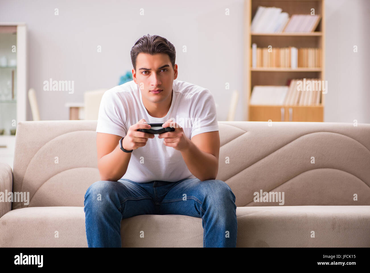 Man addicted to computer games Stock Photo - Alamy