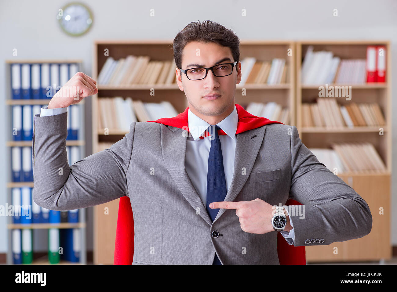 Superhero businessman working in the office Stock Photo - Alamy