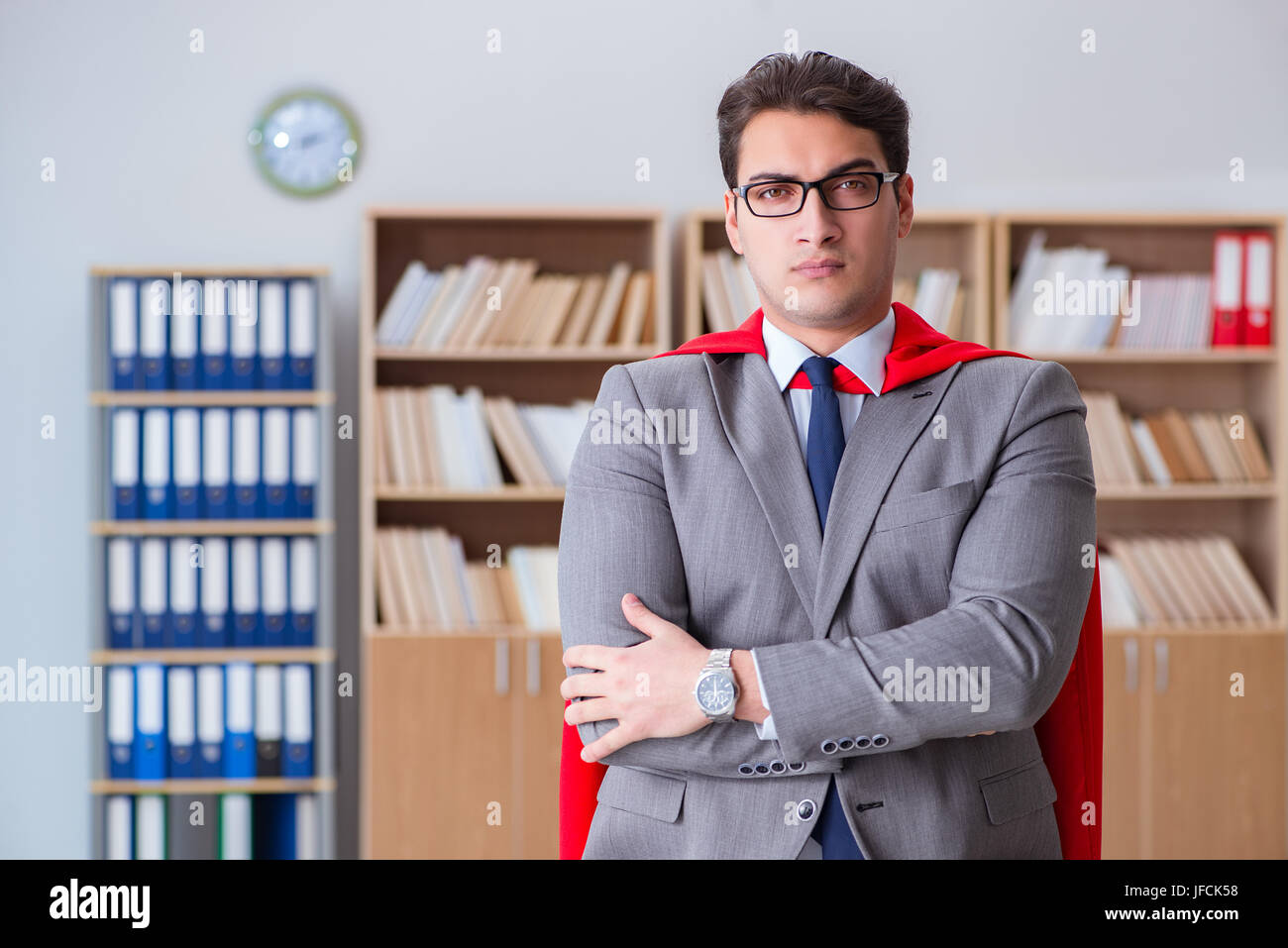 Superhero businessman working in the office Stock Photo - Alamy