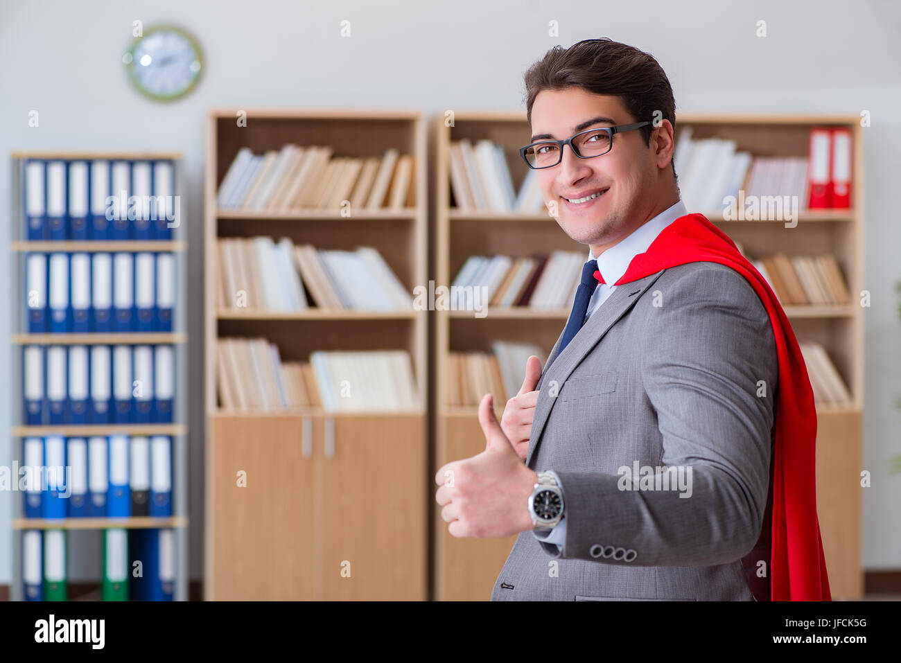 Superhero businessman working in the office Stock Photo - Alamy