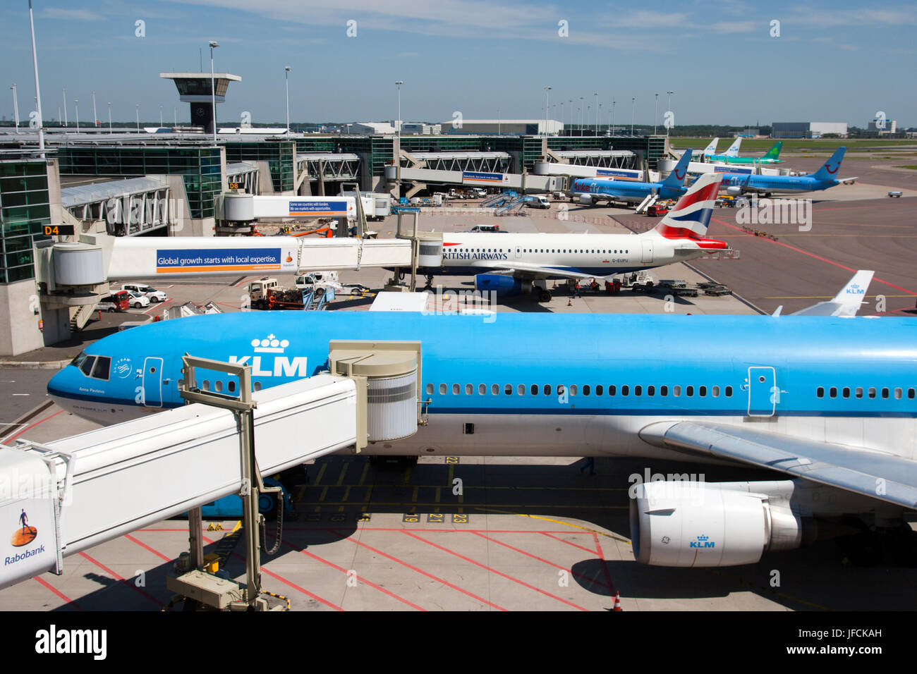 AMSTERDAM - JUNE 27: Various airlines at the gates of Amsterdam ...