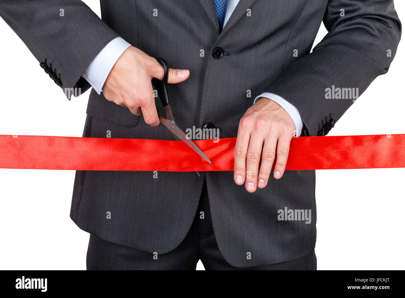 Businessman in suit cutting red ribbon with pair of scissors isolated ...