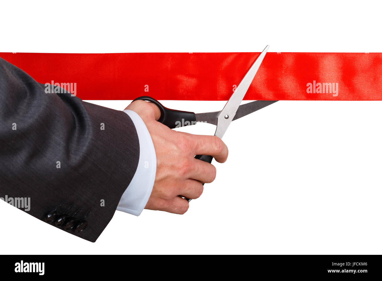Businessman in suit cutting red ribbon with pair of scissors isolated ...