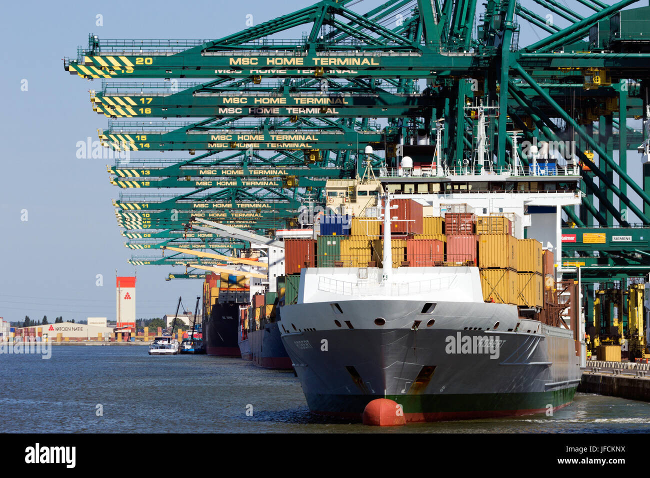 ANTWERP, BELGIUM - JULY 9: Container ship leaving MSC Home terminal ...