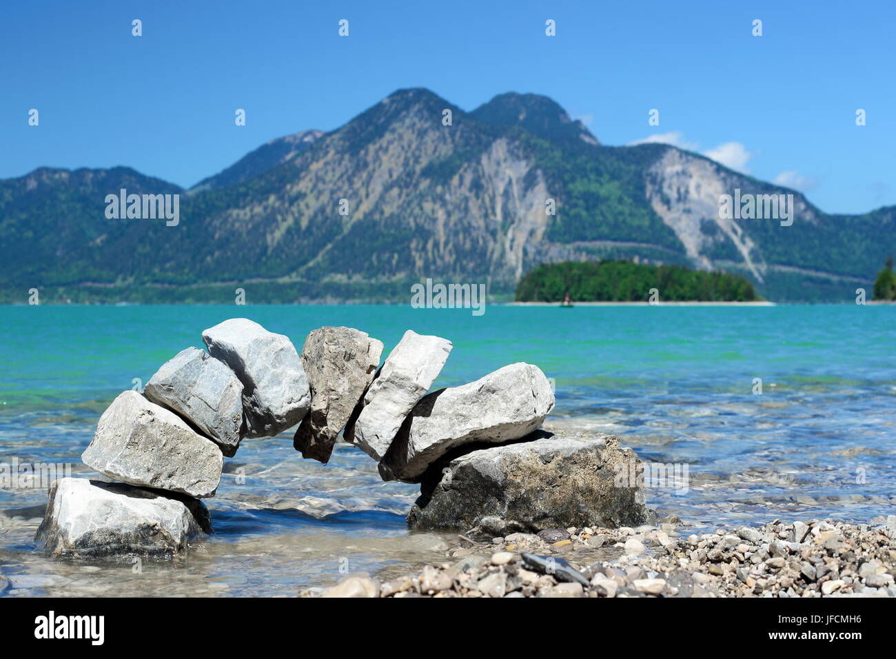 stone bow in landscape with lake Stock Photo - Alamy