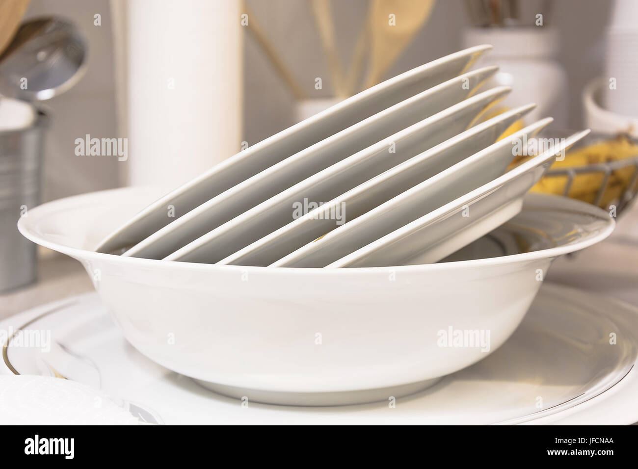 Clean plates isolated on white Stock Photo - Alamy