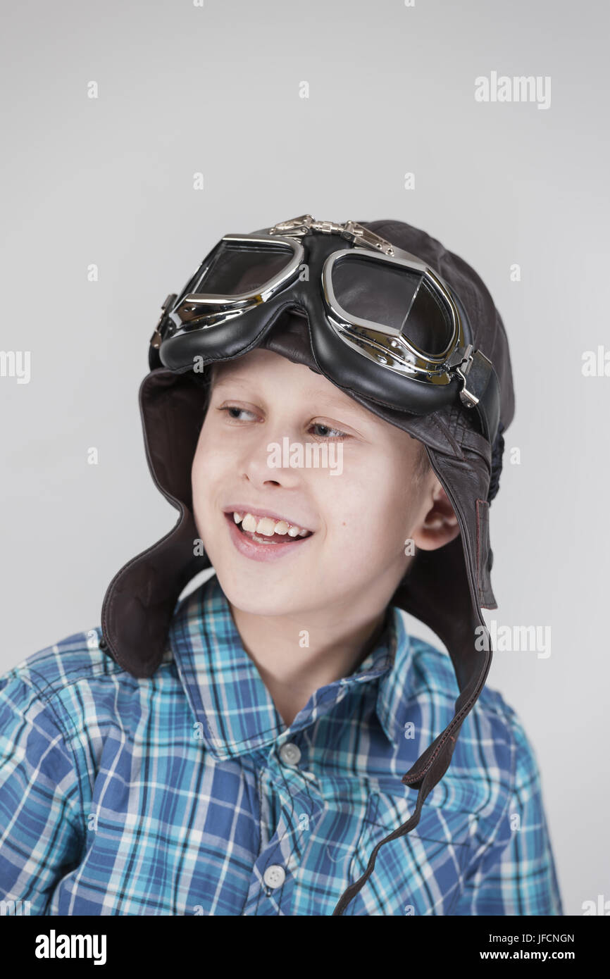 Boy with leather cap looking left Stock Photo - Alamy