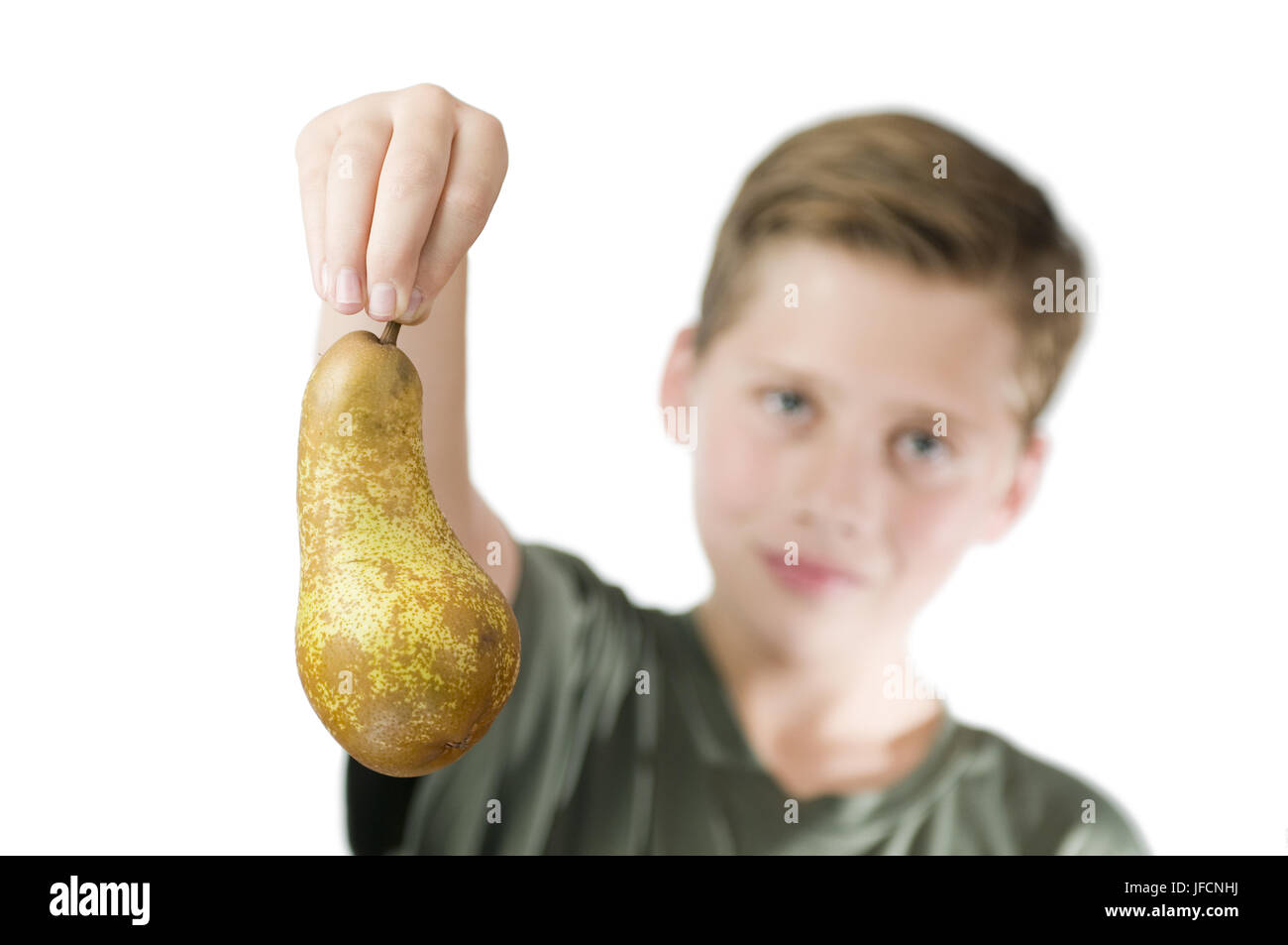 boy shows a pear on white background Stock Photo - Alamy