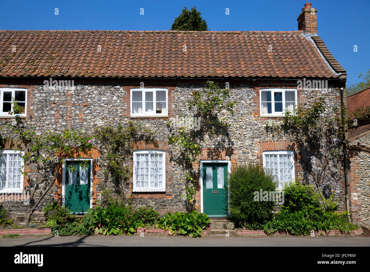 Picture shows: Traditional flint and brick houses at Castle Acre ...