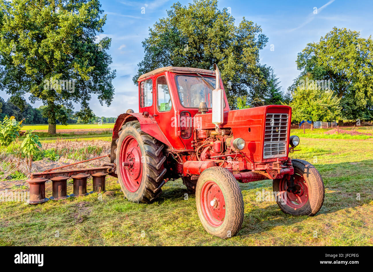 Old red tracor Stock Photo - Alamy