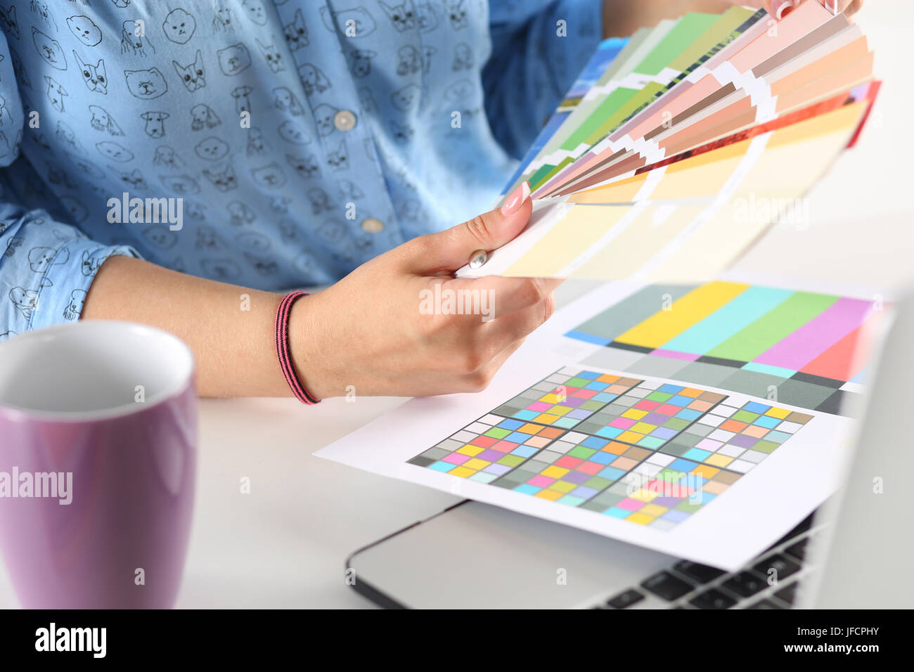 Hands of female designer in office working with colour samples. Woman ...