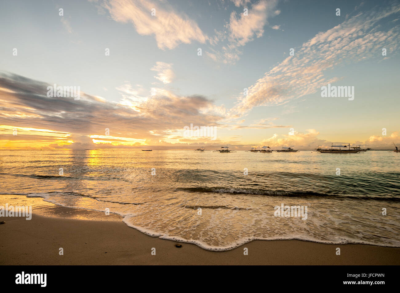 Tropical beach sunset at Philippines Stock Photo - Alamy