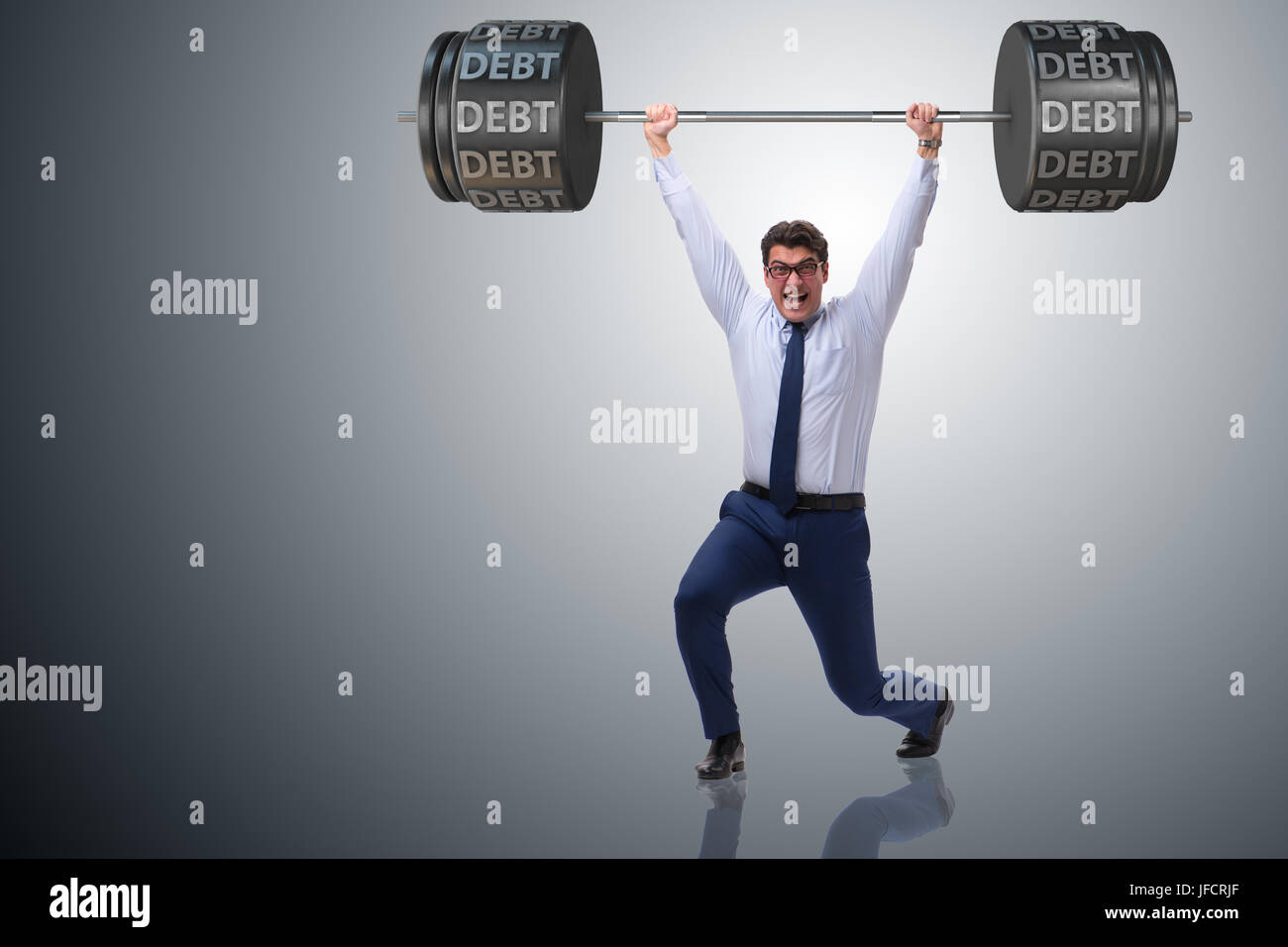 Businessman under heavy burden of debt Stock Photo - Alamy