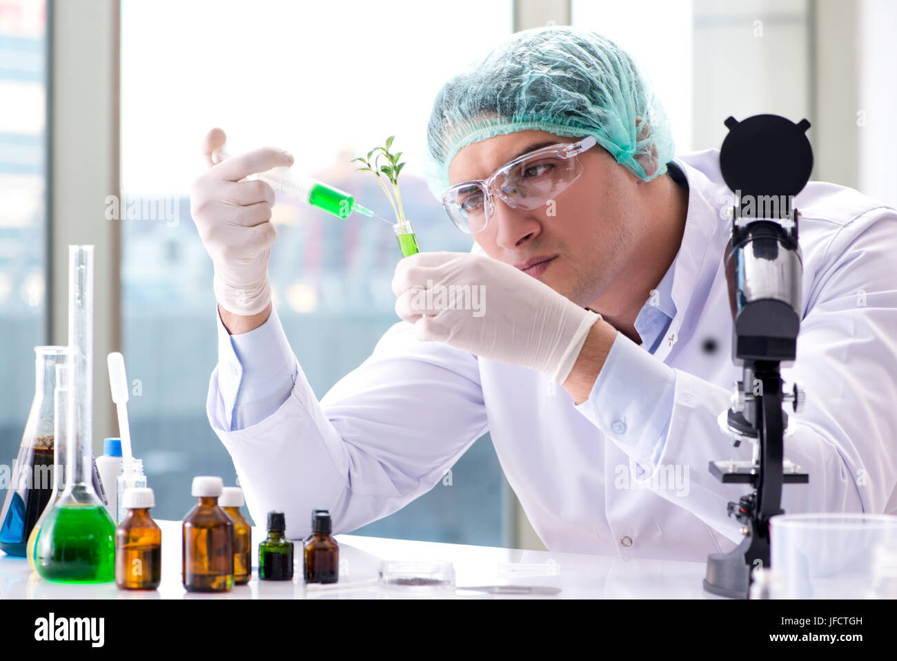Biotechnology concept with scientist in lab Stock Photo - Alamy
