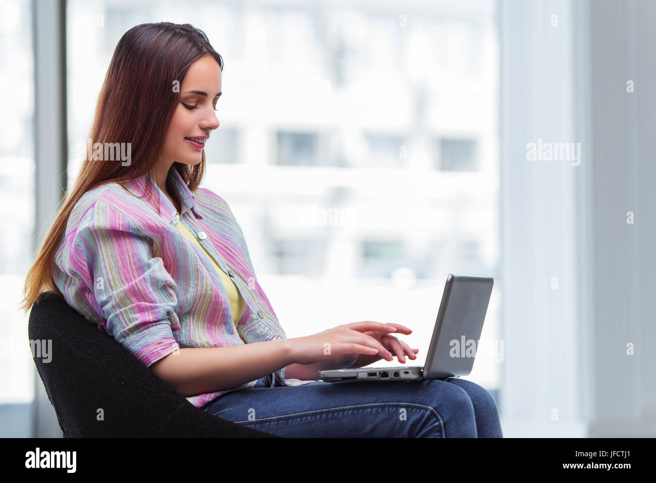 Young girl surfing internet on laptop Stock Photo - Alamy