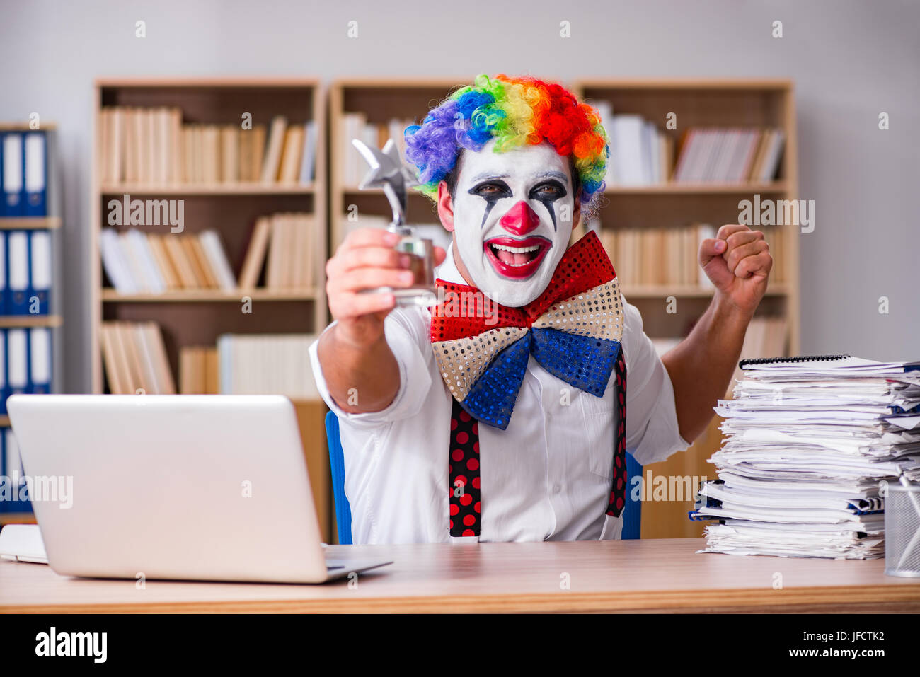 Clown businessman working in the office Stock Photo - Alamy