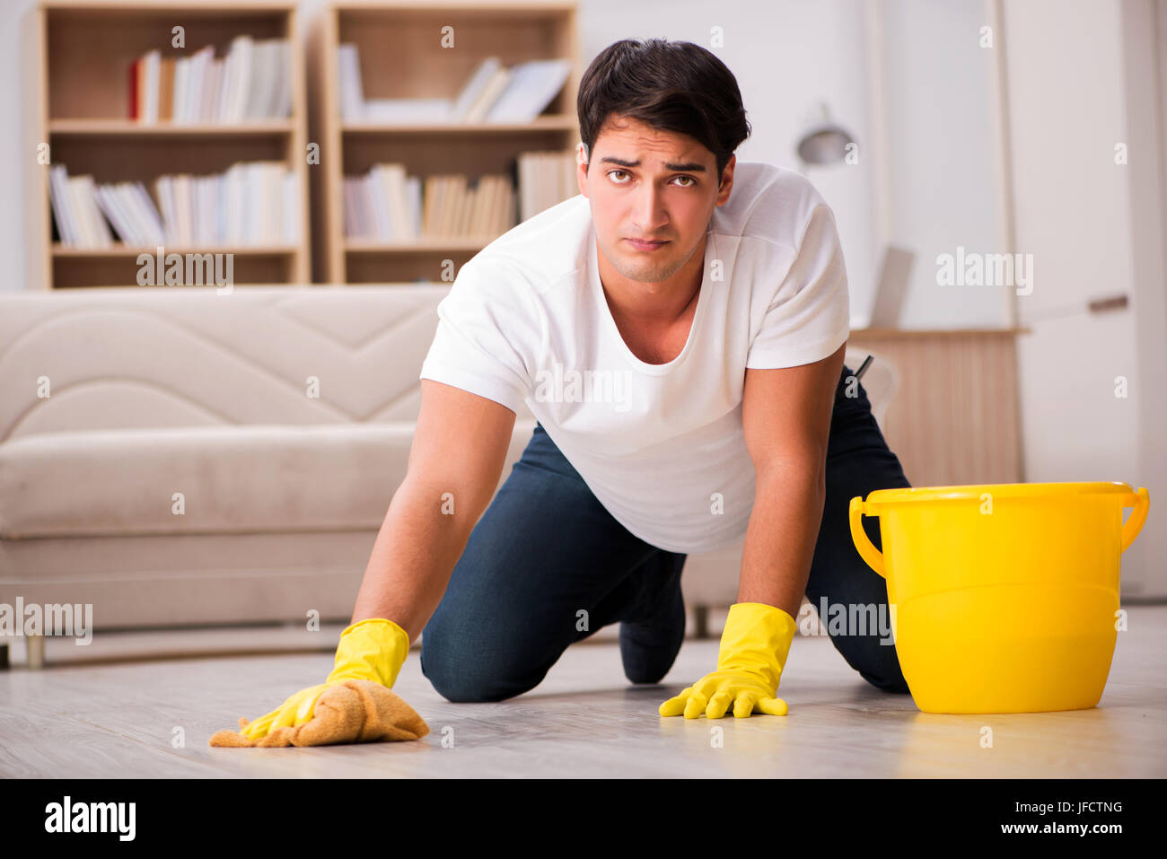 Man husband cleaning the house helping wife Stock Photo - Alamy