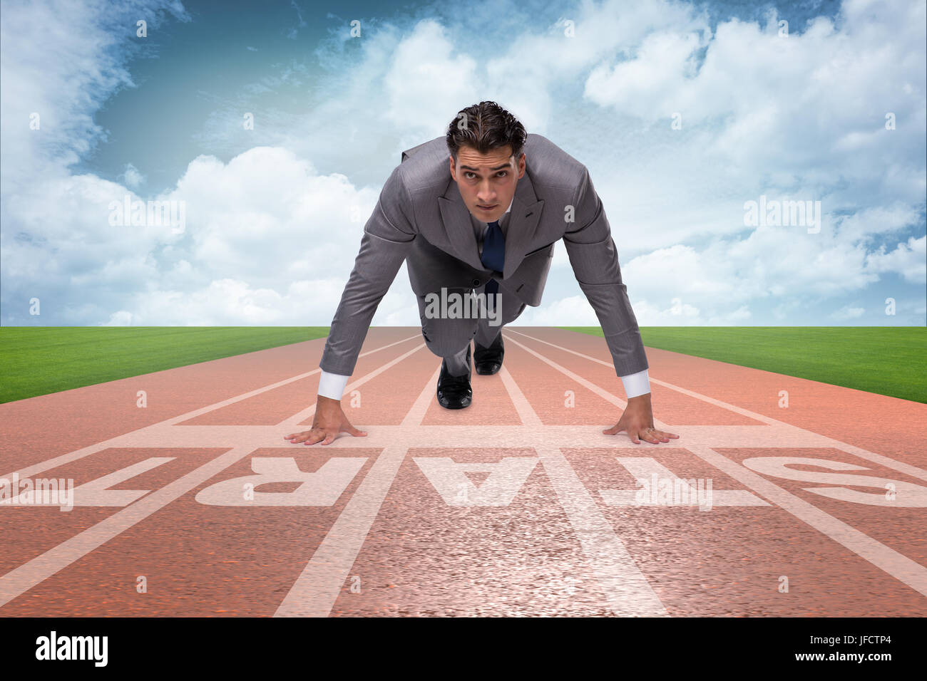 Businessman taking low start to running Stock Photo - Alamy