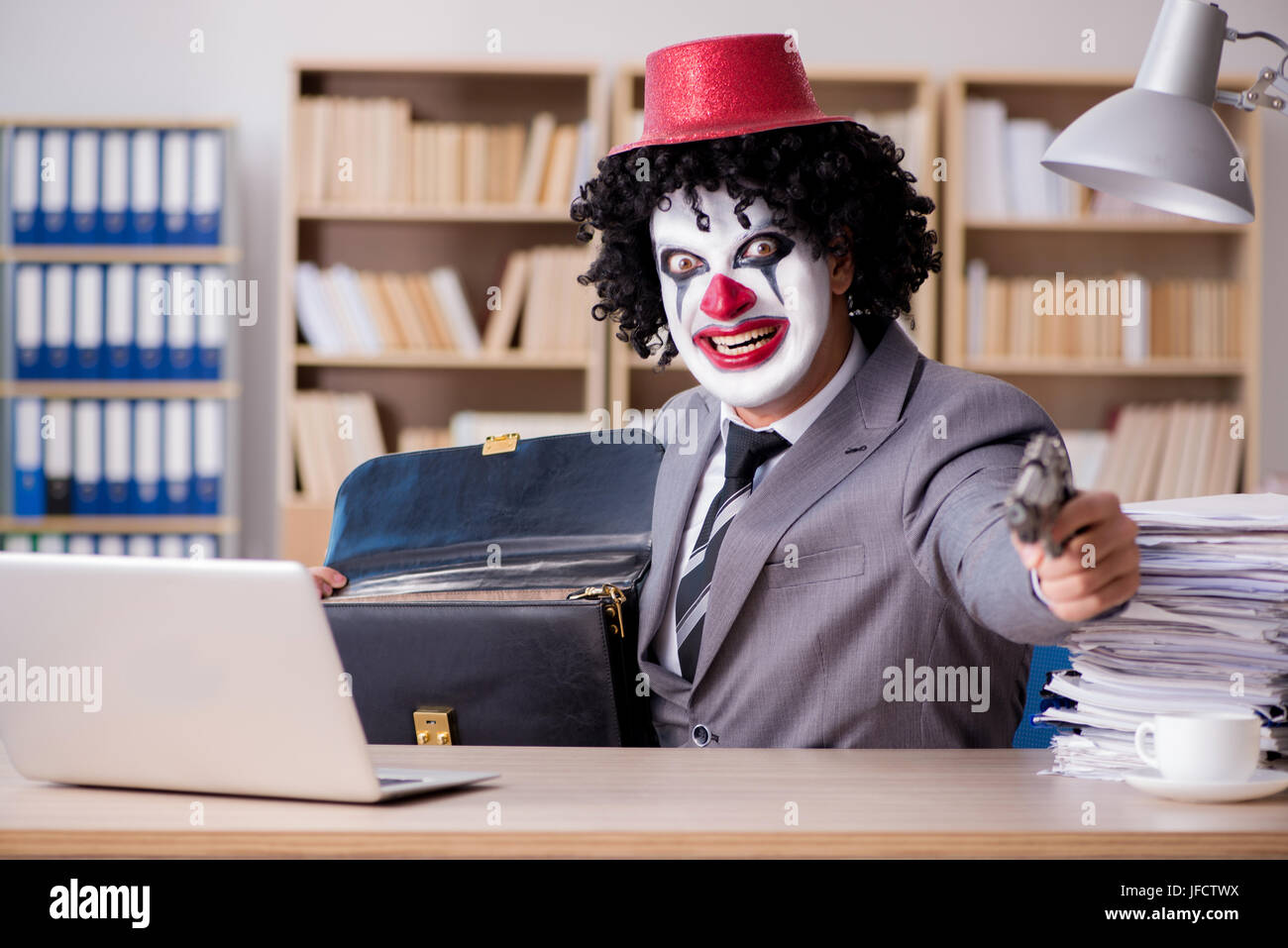 Clown businessman working in the office Stock Photo - Alamy
