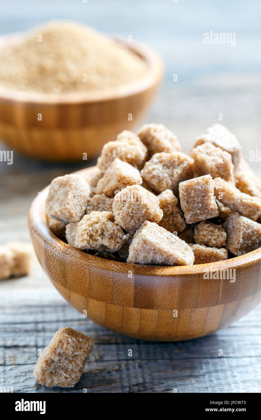 Natural cane sugar cubes in a wooden bowl Stock Photo - Alamy