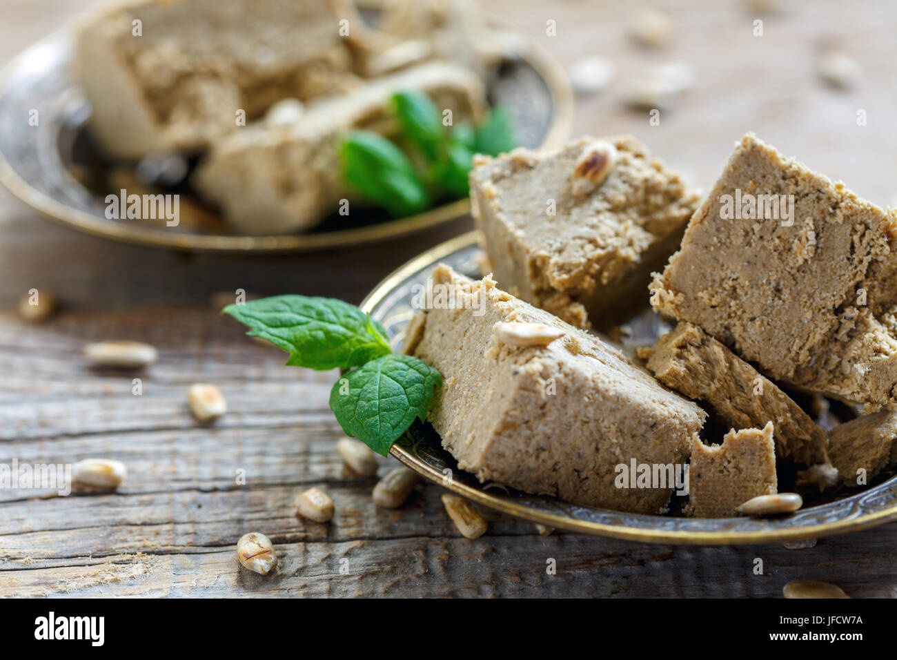 Halva from sunflower seeds on a wooden table close-up Stock Photo - Alamy