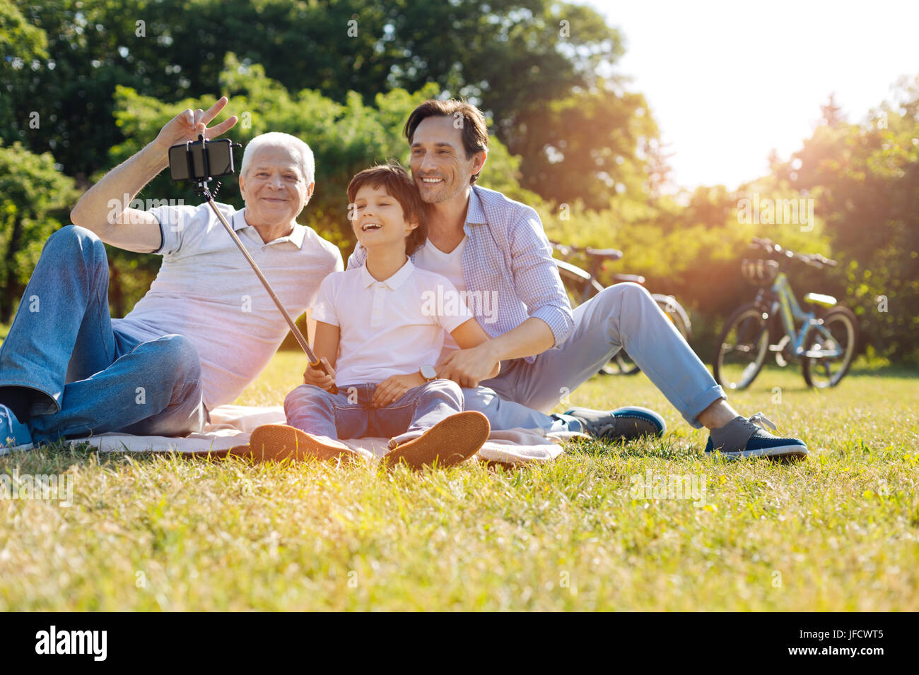 Preserving memories. Charming admirable optimistic family having an ...