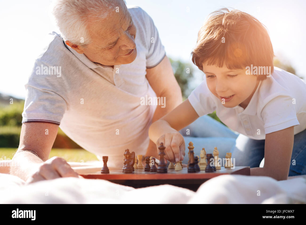 Attentive learner. Dedicated persistent talented boy looking excited ...