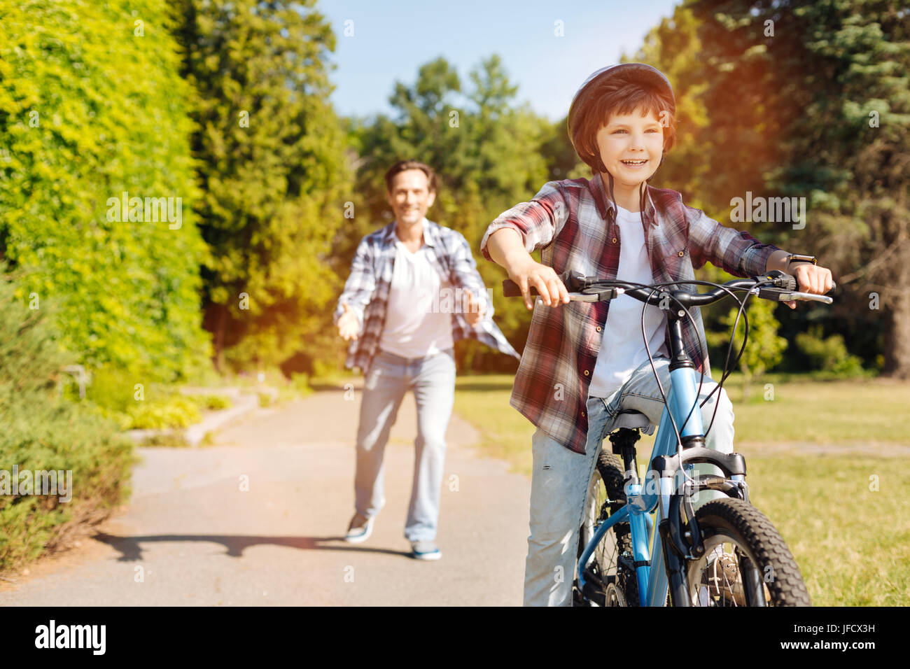 Letting go. Adorable emotional energetic child looking exited while ...