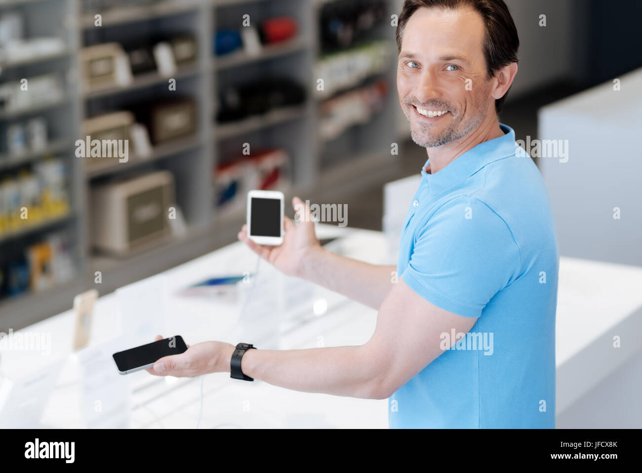 Do not know which one to choose. Radiant man grinning widely while ...