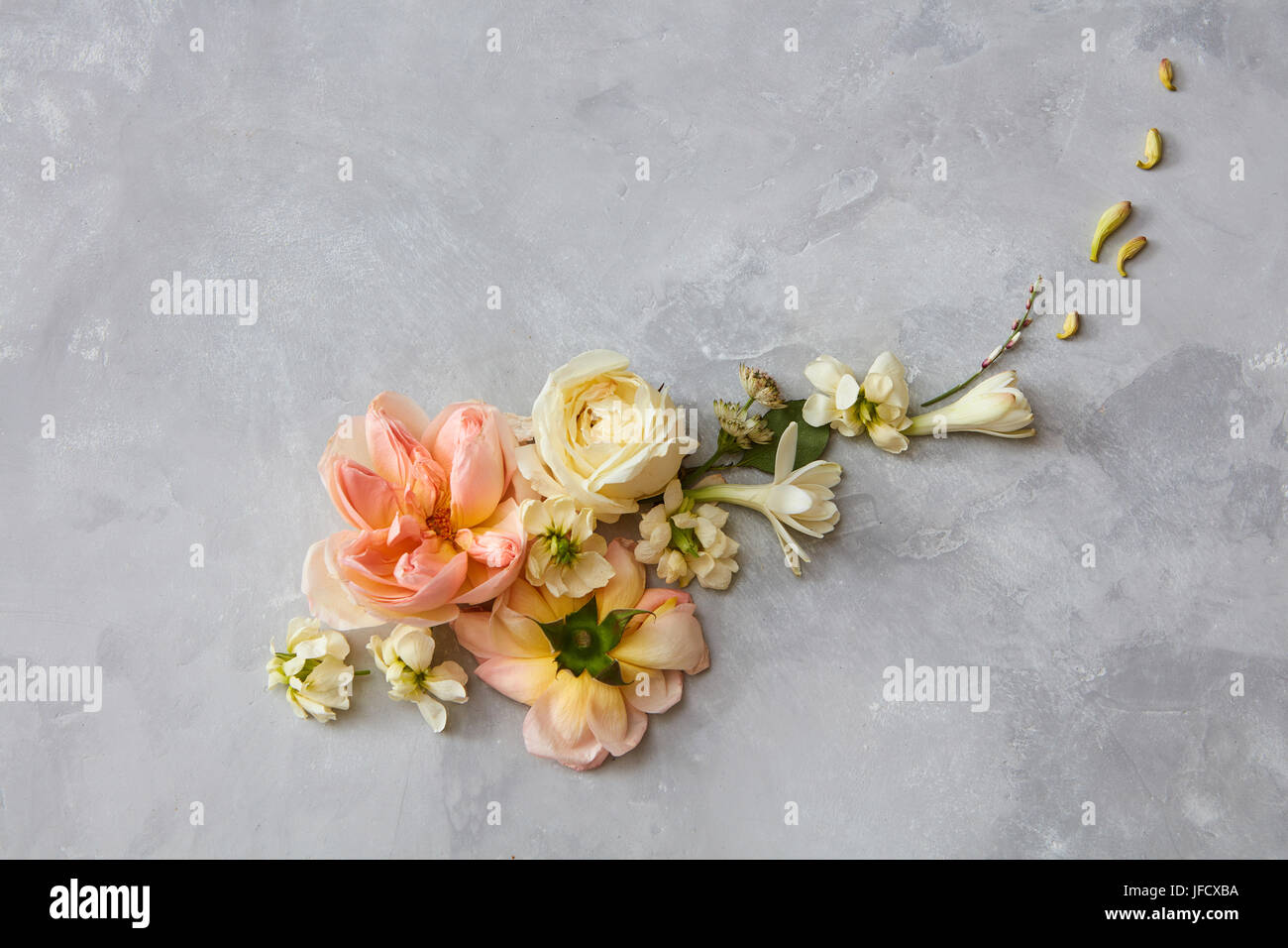 Composition of flowers on grey background Stock Photo - Alamy