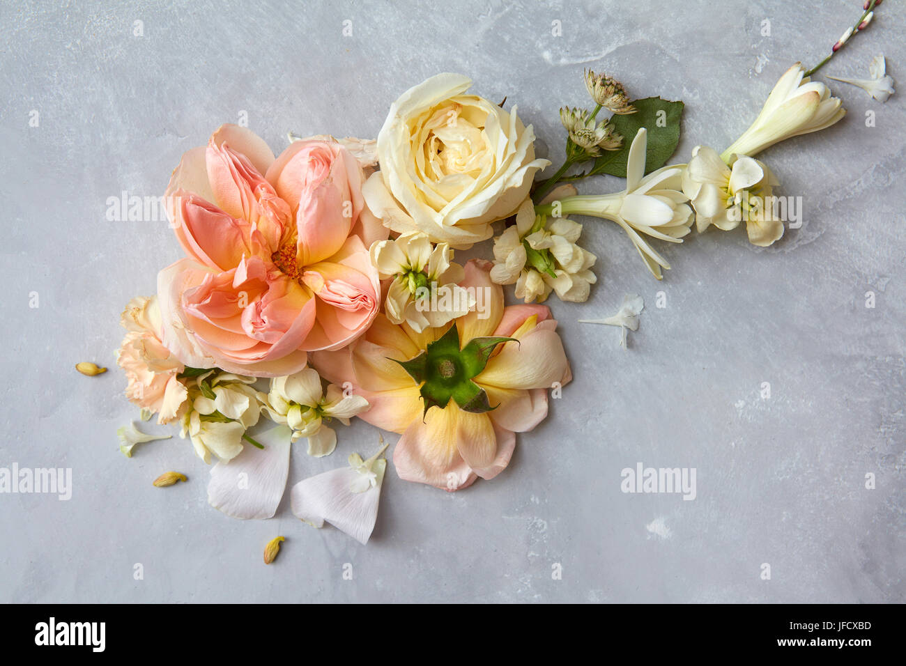 Composition of flowers on grey background Stock Photo - Alamy