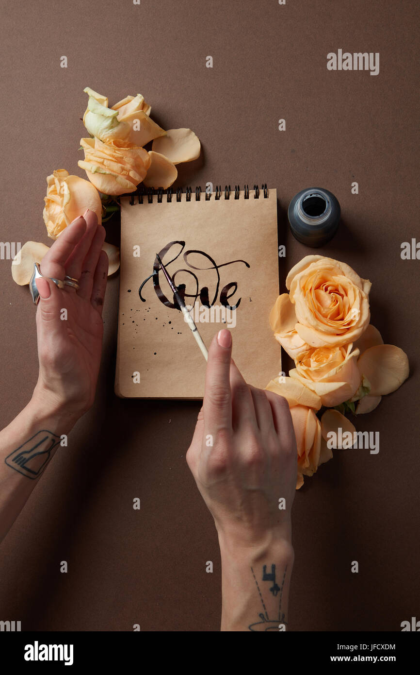 Diary or notebook with word love Stock Photo - Alamy