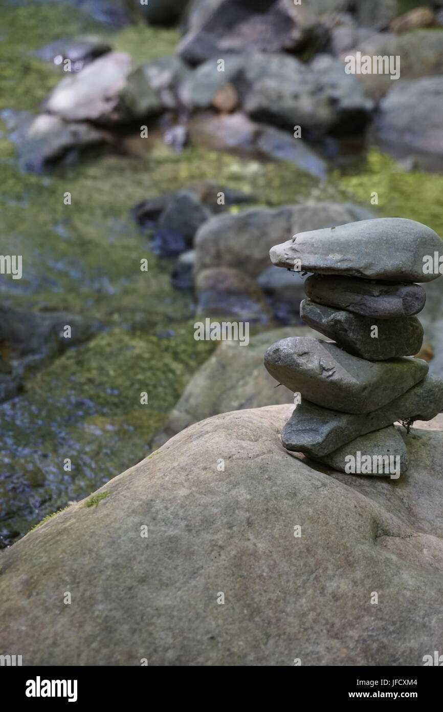 a small stack of rocks left behind on a river traill Stock Photo - Alamy