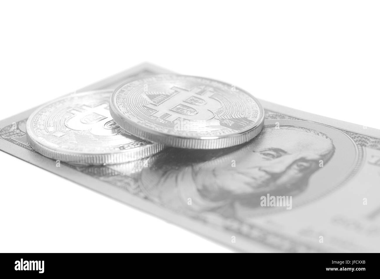 Silver bitcoins with U.S. dollar isolated on white Stock Photo - Alamy