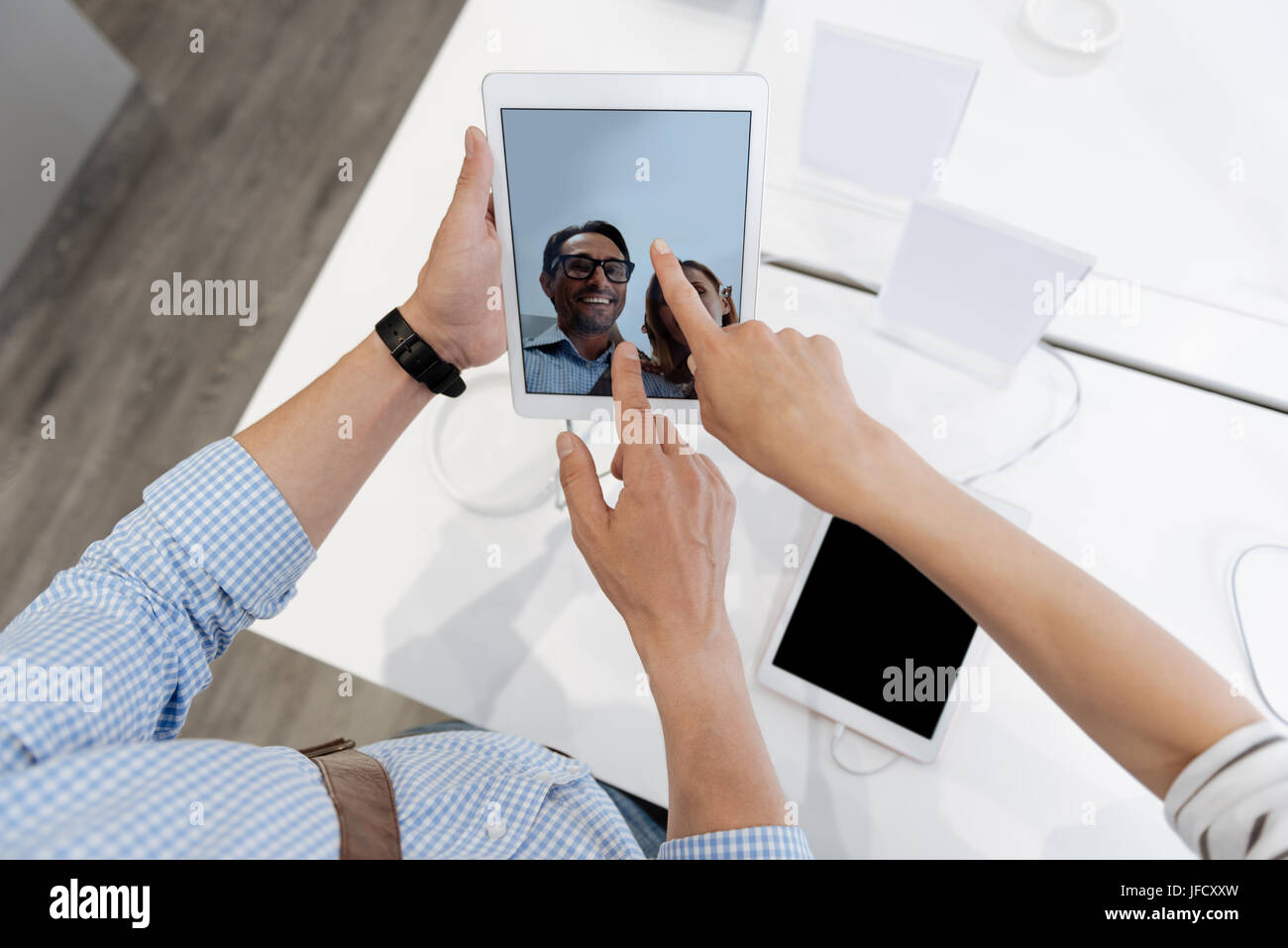 The quality is really nice. Close up of shoppers hands testing ...