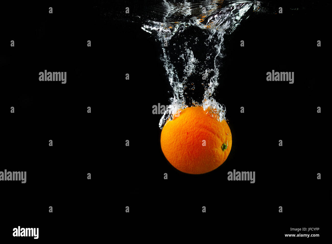 Orange in water Stock Photo - Alamy