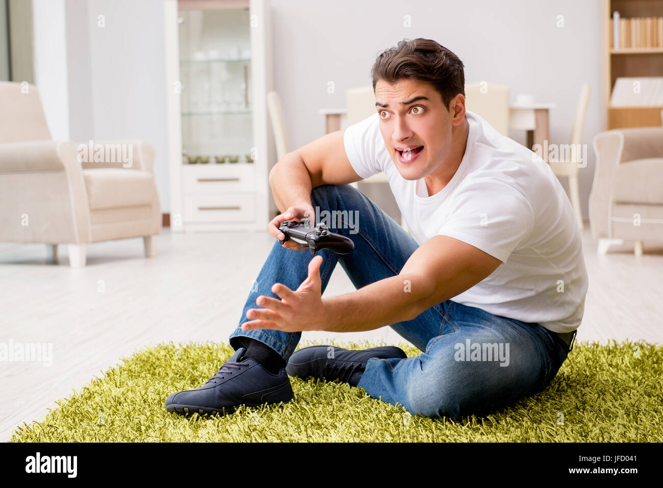 Man addicted to computer games Stock Photo - Alamy