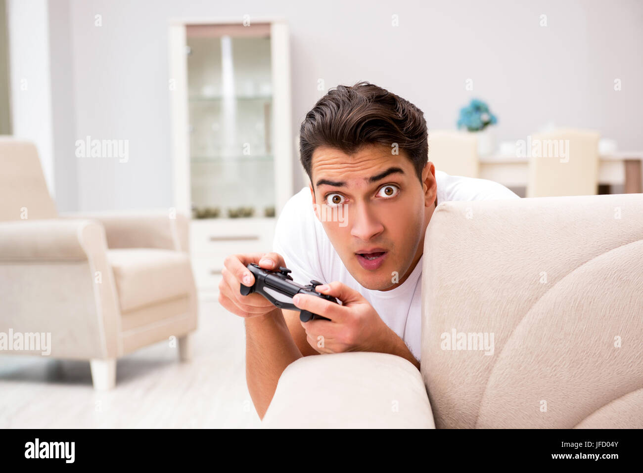 Man addicted to computer games Stock Photo - Alamy