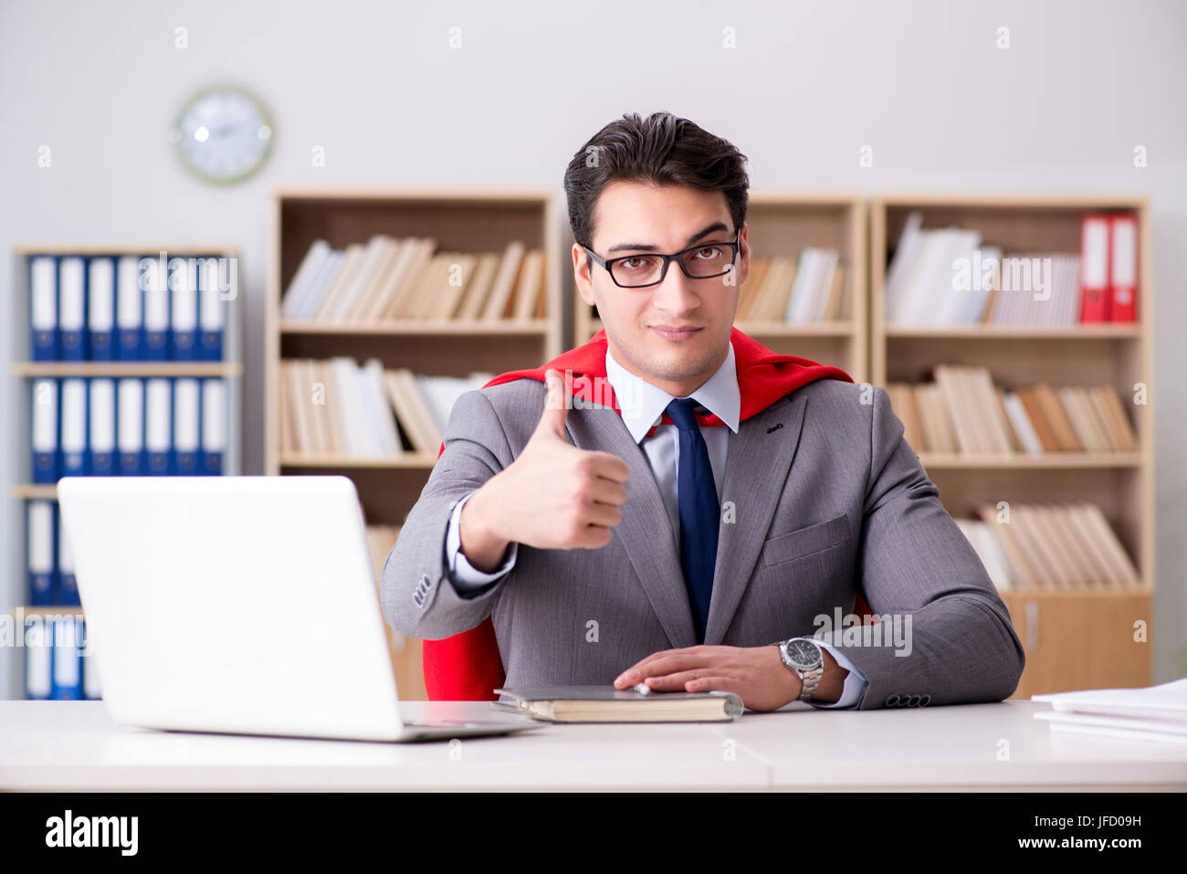 Superhero businessman working in the office Stock Photo - Alamy