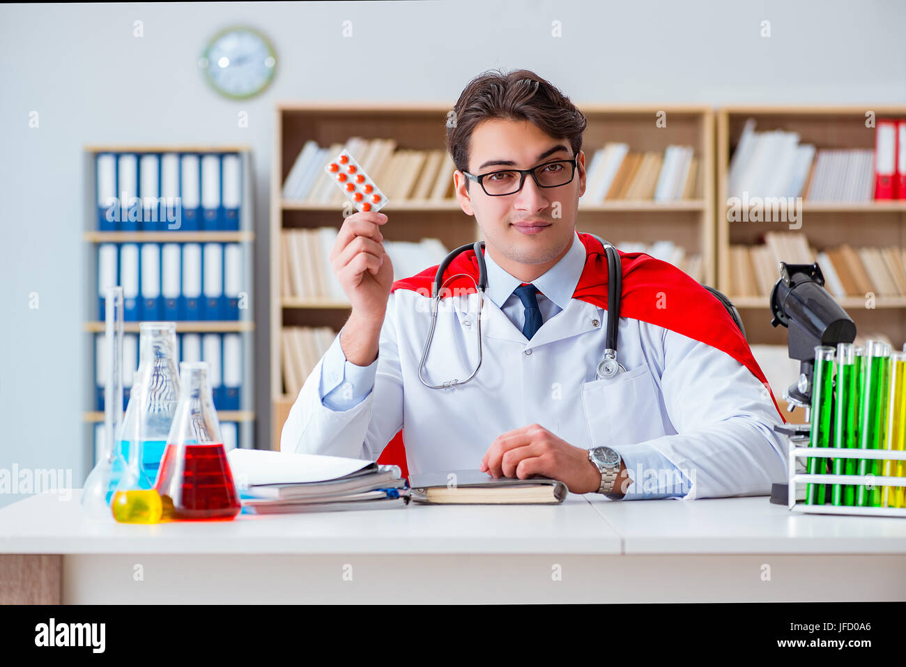 Superhero doctor working in the hospital lab Stock Photo - Alamy